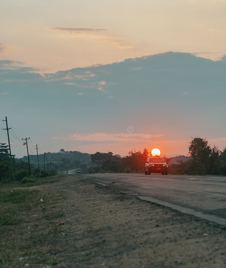 A sunset over a car editorial photo. Image of view, rural - 189045486