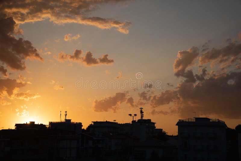 Sunset Over the City in the Evening, Silhouette of a Building Stock ...
