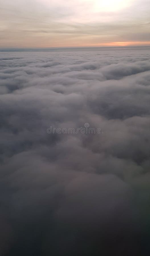 Sunset over the clouds stock photo. Image of beauty - 171019916