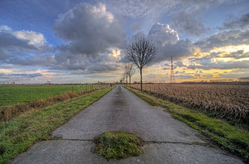 Sunset Over Countryside Road Stock Photo - Image of countryside ...