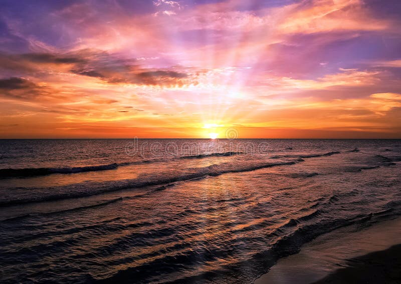 Sunset Over the Cuban Beach with Visible Sun Rays Stock Photo - Image ...