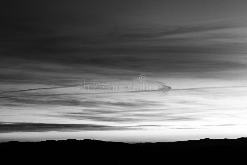 Sunset Over Distant Mountains, with Deep Sky Full of White Clouds and ...