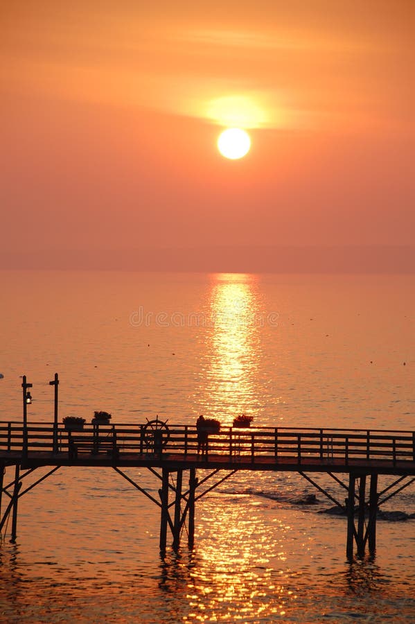 Sunset over dock stock image. Image of waves, sunset - 19695137
