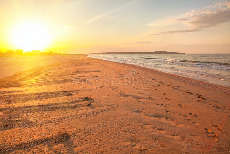 Sunset over empty beach stock photo. Image of beach, touristic - 65386740