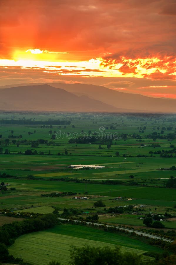 Sunset over the field stock photo. Image of green, cloudscape - 28798226