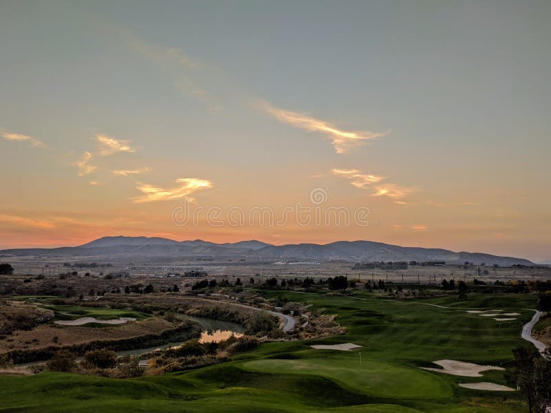 Sunset over golf course stock photo. Image of golf, mountains - 198674690