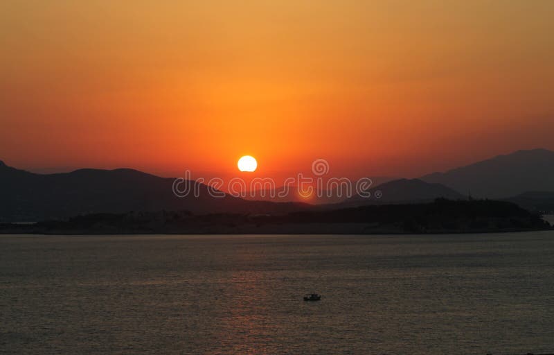 Sunset over Greek Island stock image. Image of mountains - 78408083