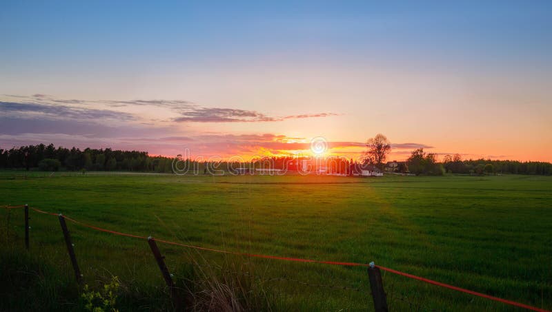 Sunset Over the Green Field Stock Image - Image of natural, dramatic ...