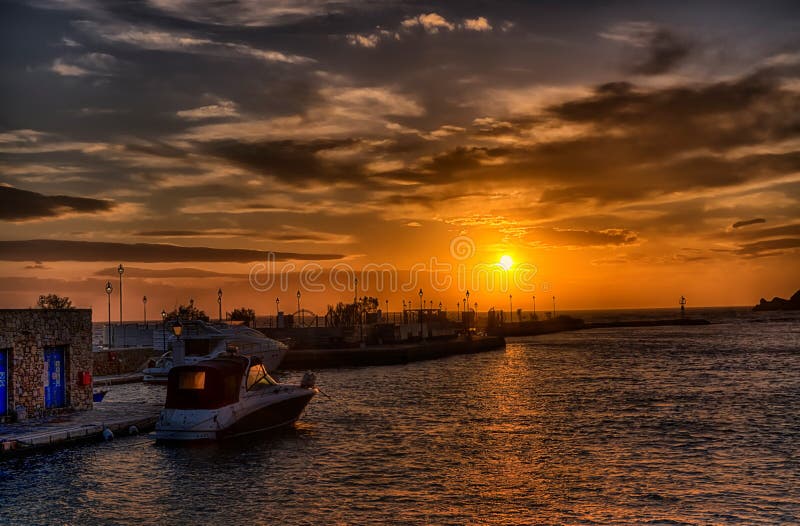 Sunset over the harbor stock image. Image of mykonos - 31606131