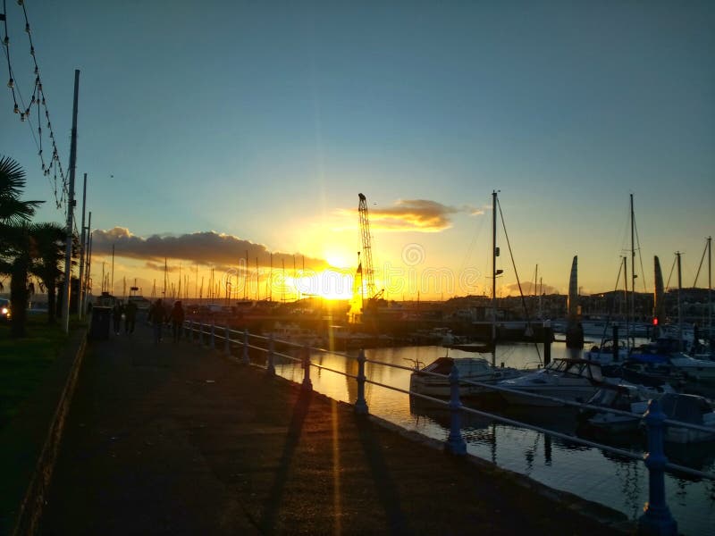 Sunset over harbour stock image. Image of boats, sunset - 105014181