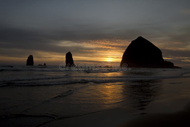 Sunset Over Haystack Rock in Cannon Beach Stock Image - Image of ...