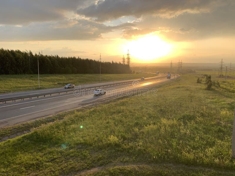 Sunset over highway stock image. Image of sunbeam, outdoor - 231056489