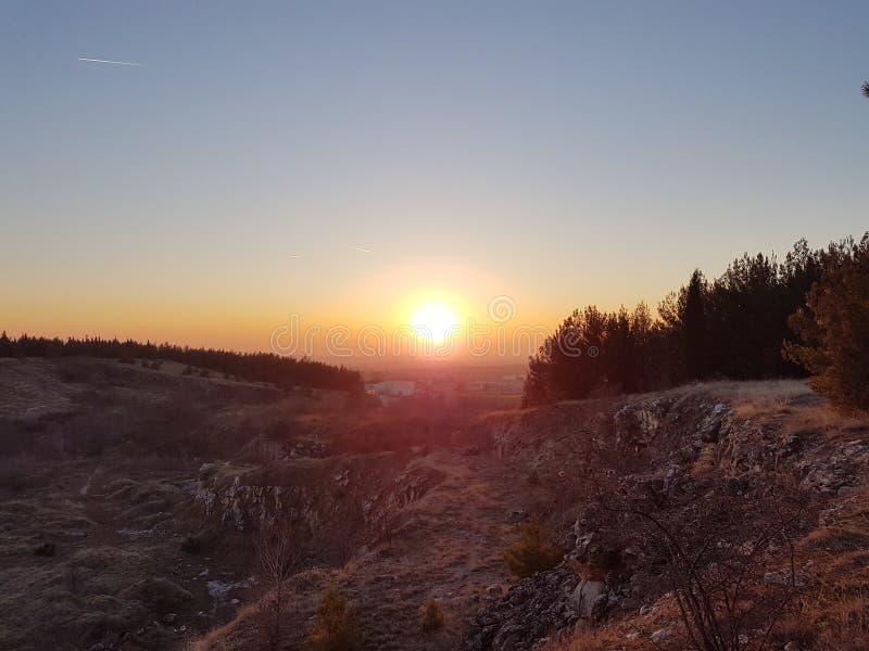 Sunset over hill, blue sky stock image. Image of scenery - 125677385