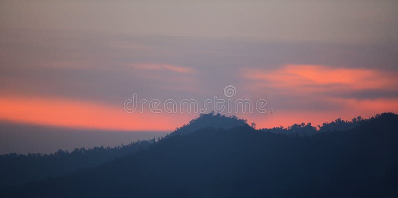 Sunset over the hills stock photo. Image of east, tree - 187664570