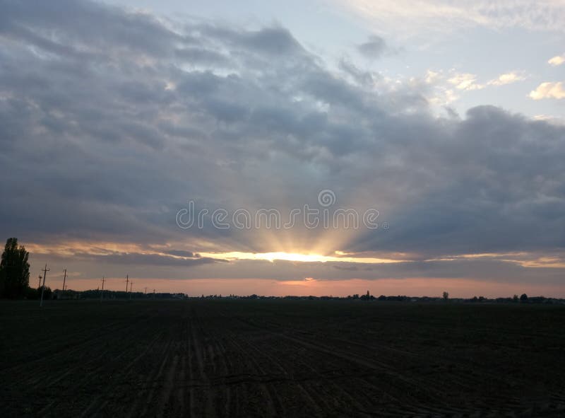 Sunset over the horizon stock photo. Image of sunset - 147275074