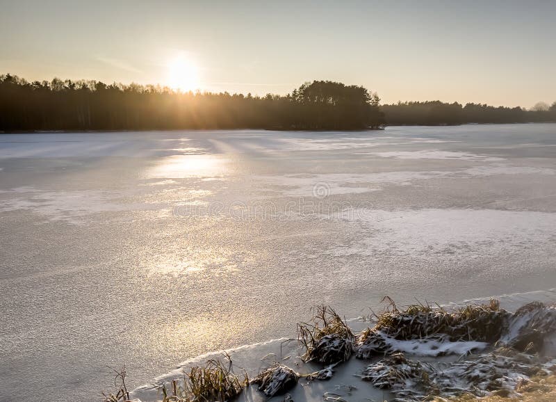 Sunset Over the Ice-covered Surface of the Lake Stock Photo - Image of ...