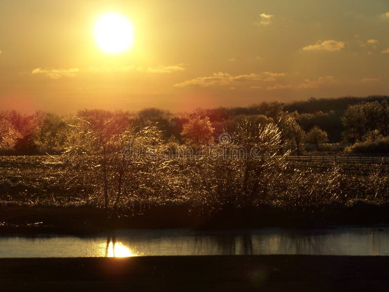 Sunset Over Ice, Trees, and Pond. Stock Image - Image of reflection ...