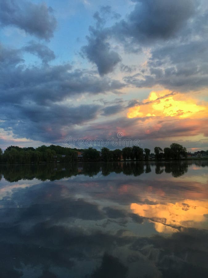 Sunset over the lake stock image. Image of dramatic - 154834465