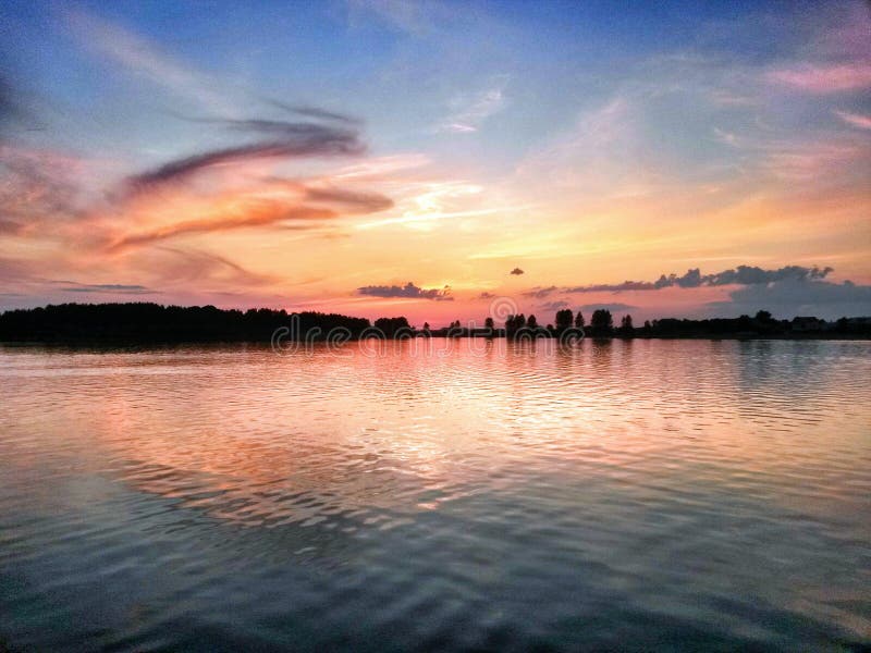 Sunset over the lake stock photo. Image of beautiful - 43031700