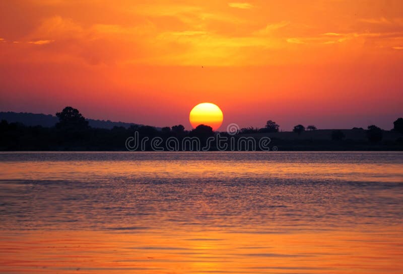 Sunset over the lake stock image. Image of large, lake - 61998977