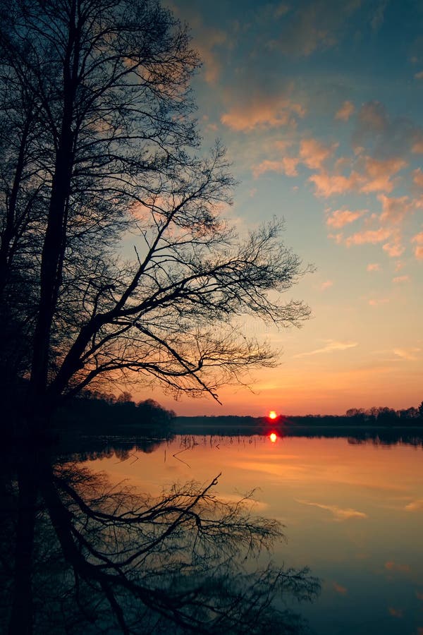 Sunset over the lake stock image. Image of dusk, beautiful - 233965471