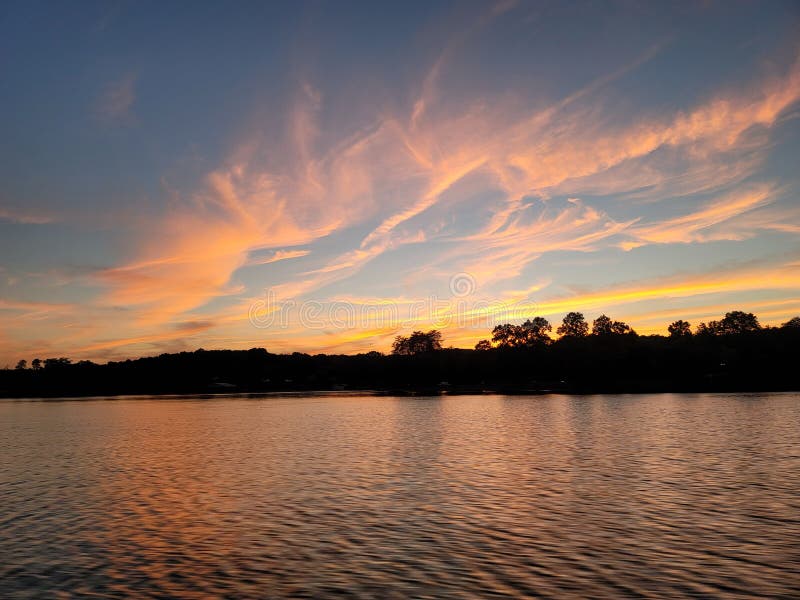 Sunset Over a Lake Blue Sky Orange Clouds Stock Image - Image of blue ...