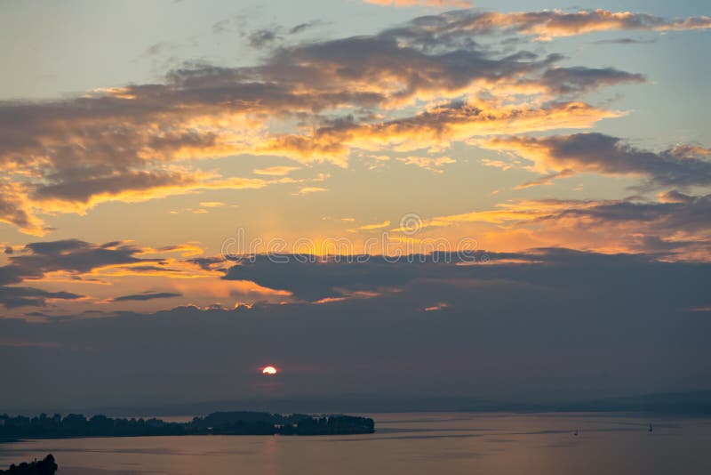 Sunset over lake stock photo. Image of brush, clouds - 192531722