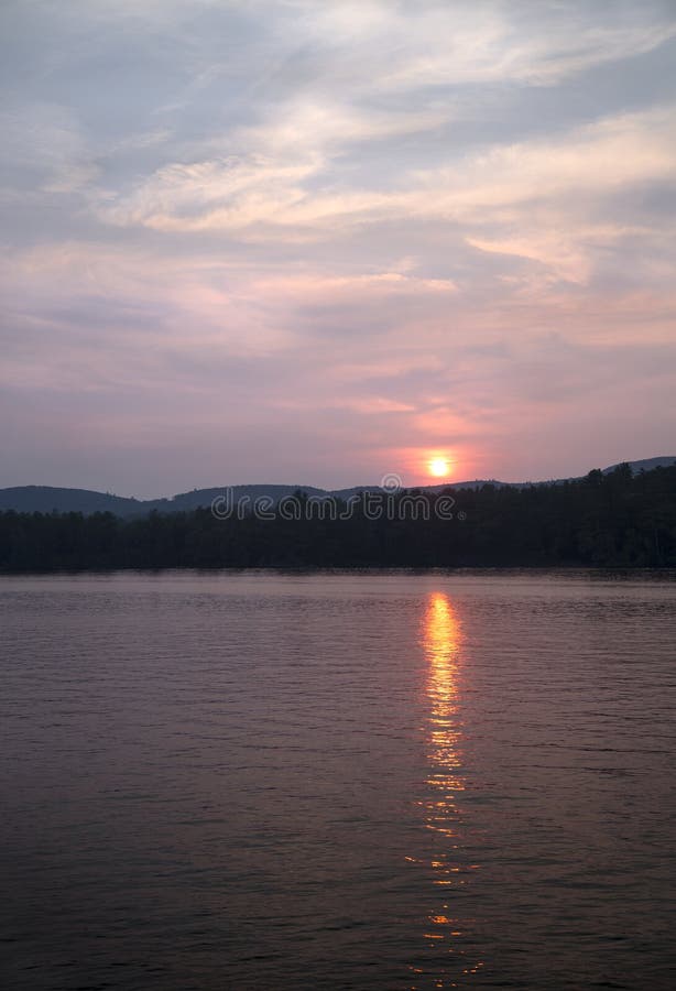 Sunset over a Lake stock photo. Image of dusk, summer - 78337100