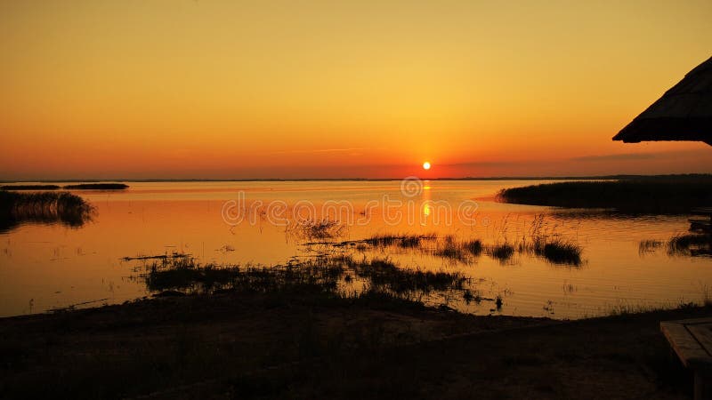 Sunset Warm Orange Sky Over Lake Stock Photo - Image of cloudy, lake ...