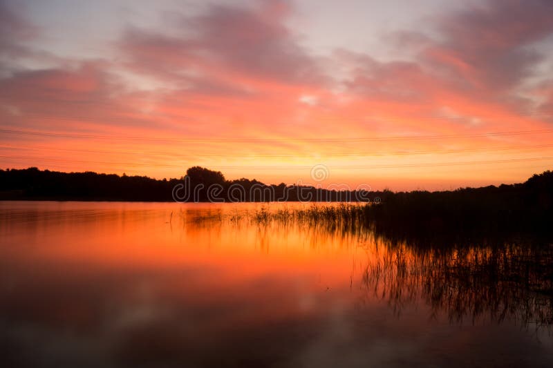 Sunset over lake stock photo. Image of calm, reflection - 82987138