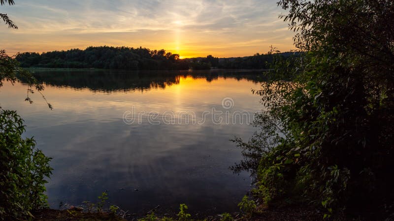 Sunset over lake stock image. Image of lake, glow, comfort - 120504739