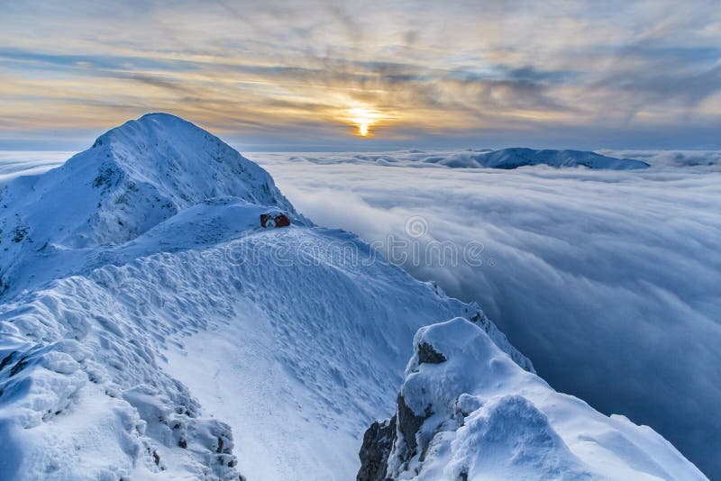Sunset Over the Mountains and Clouds in Winter Stock Photo - Image of ...