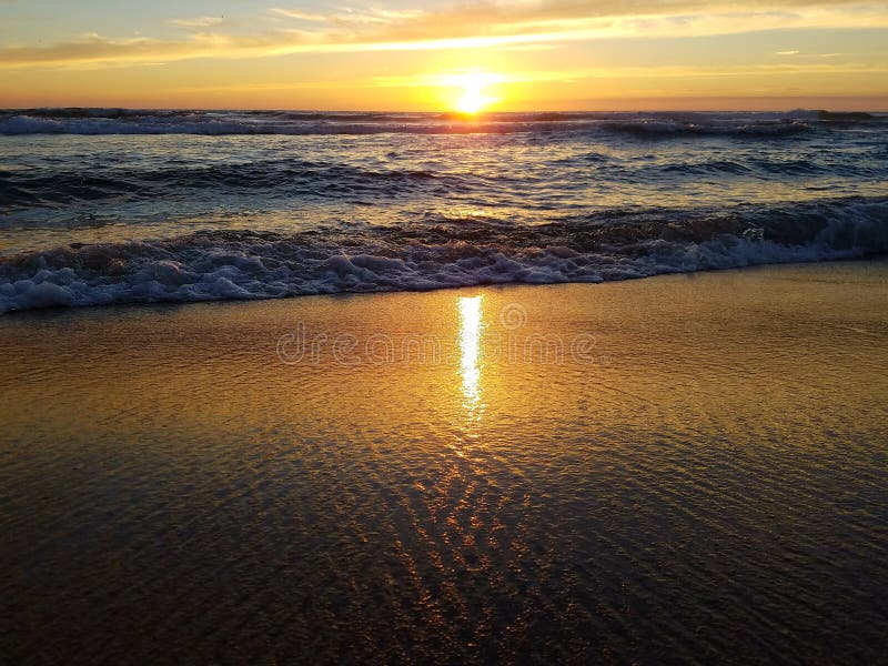 Sunset Over the Ocean from the Beach Stock Image - Image of waves ...