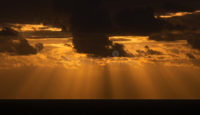 God Rays through Dark Clouds at Sunset Stock Image - Image of sunset ...