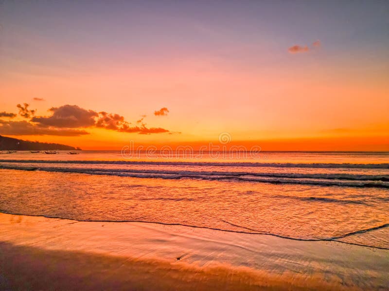 Sunset Over the Ocean in Jimbaran Beach, Bali Stock Photo - Image of ...