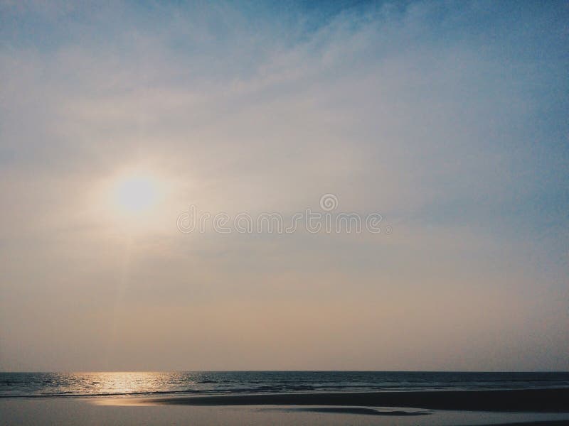 Sunset Over the Ocean. Sand Beach is Painted in Bright Colors in the ...