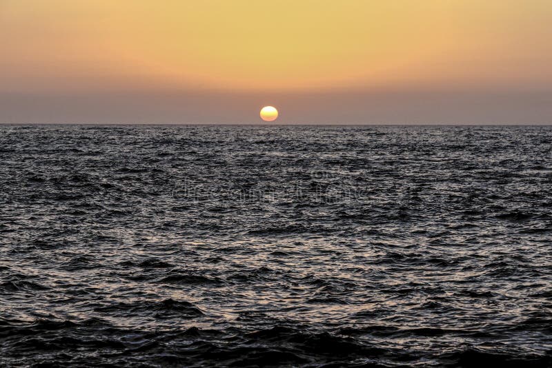 Sunset Over the Ocean in a Sea without Waves Stock Photo - Image of ...