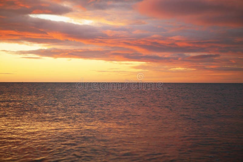 Sunset over the ocean stock image. Image of orange, shore - 38691137