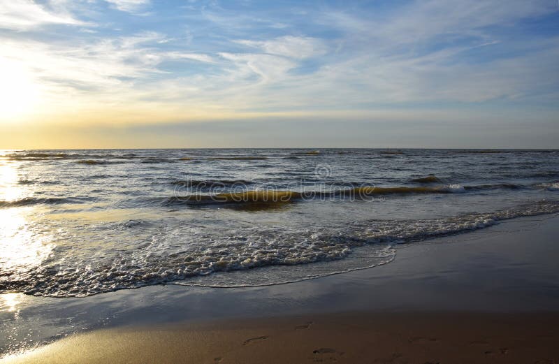 Sunset Over the Ocean - View of the Red Sun Sinking into the Horizon ...