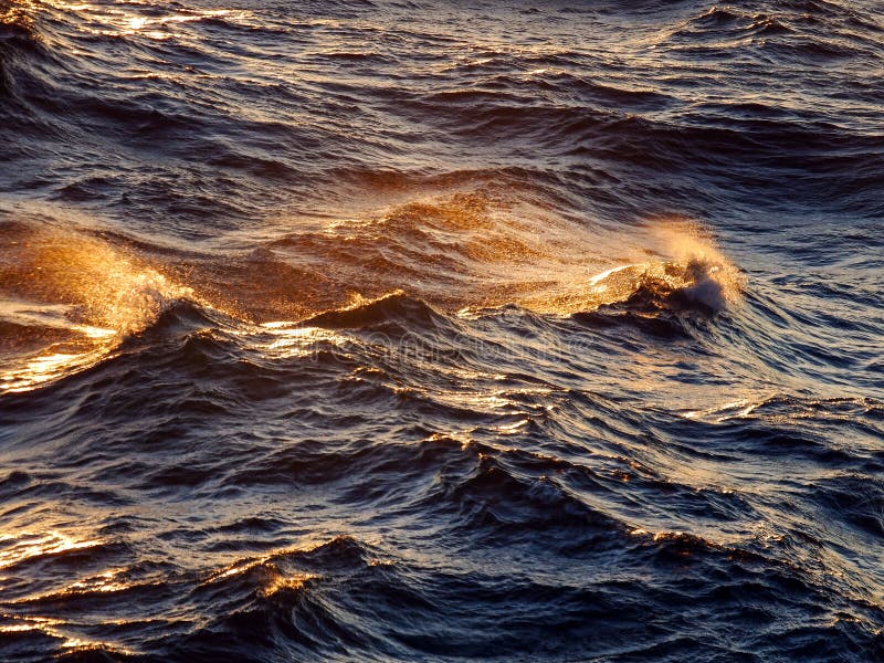 Sunset over ocean wave stock image. Image of water, light - 96972127