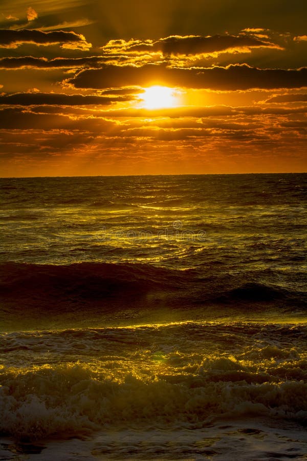 Sunset Over the Ocean with Waves Vertical Stock Photo - Image of ocean ...
