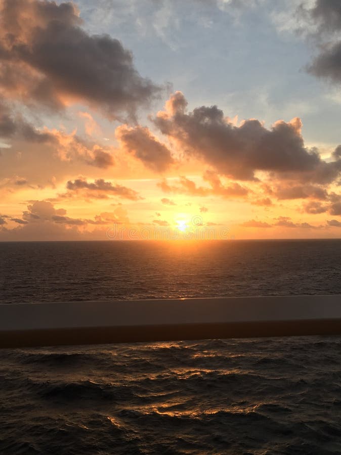 The Sunset Over the Open Ocean Stock Photo - Image of orange, flat ...