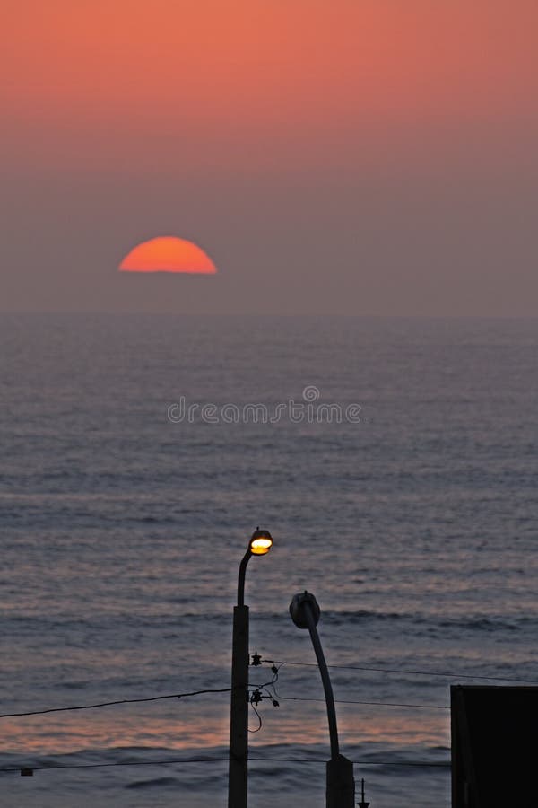 Sunset Over the Peruvian Pacific with Building Reference and Public ...