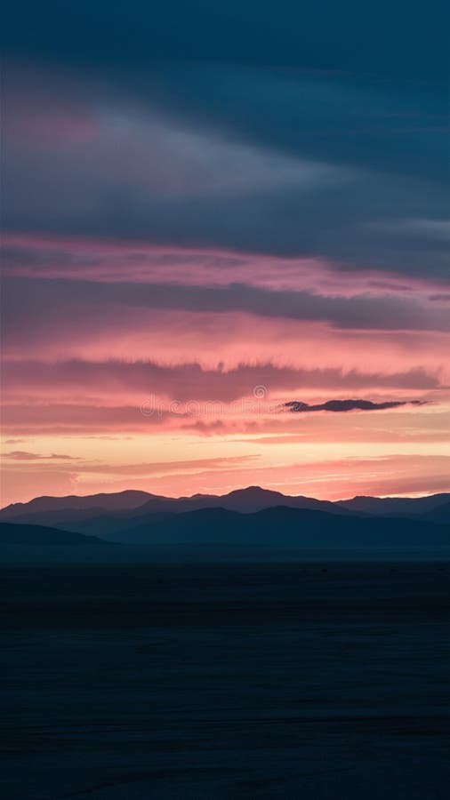 Sunset Over Plain, Colors Transitioning, Distant Mountains Silhouette ...