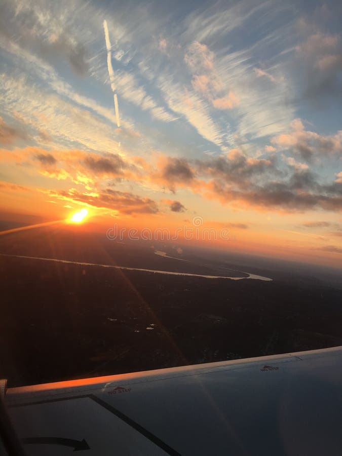 Sunset over plane wing stock photo. Image of setting - 81874246
