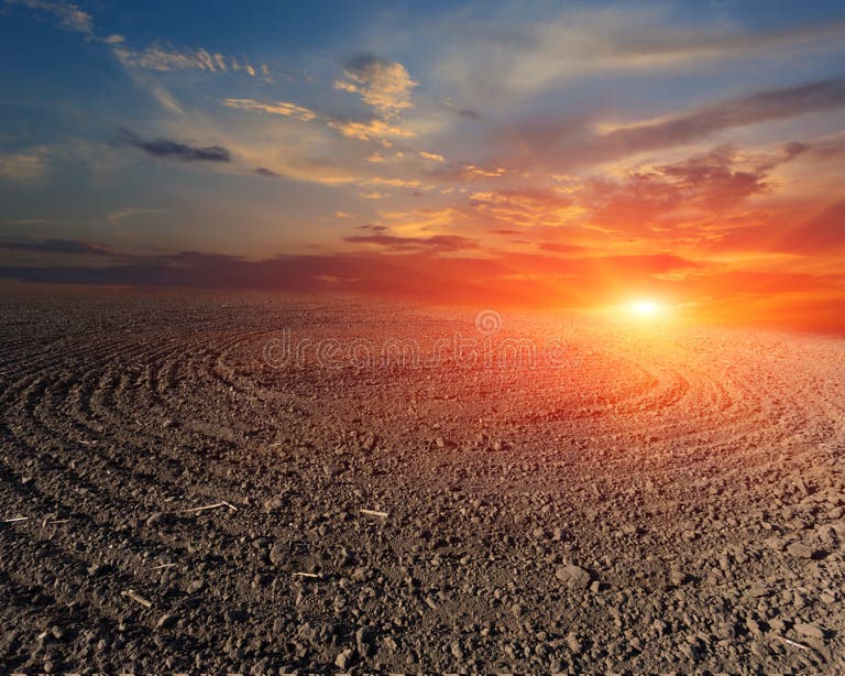 Sunset over ploughed field stock image. Image of nature - 32555563