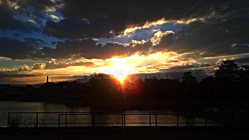 Sunset over pond stock photo. Image of running, track - 72340772