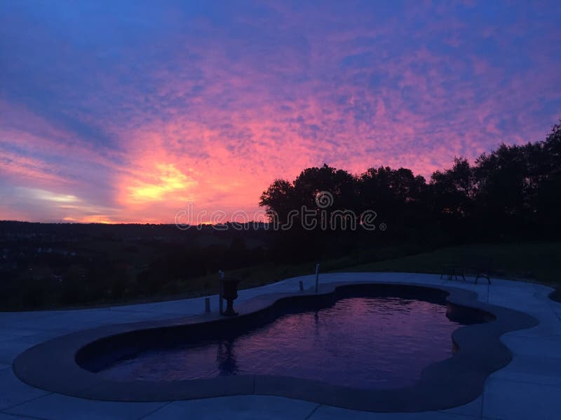 Sunset over pool stock image. Image of nature, backyard - 129543951