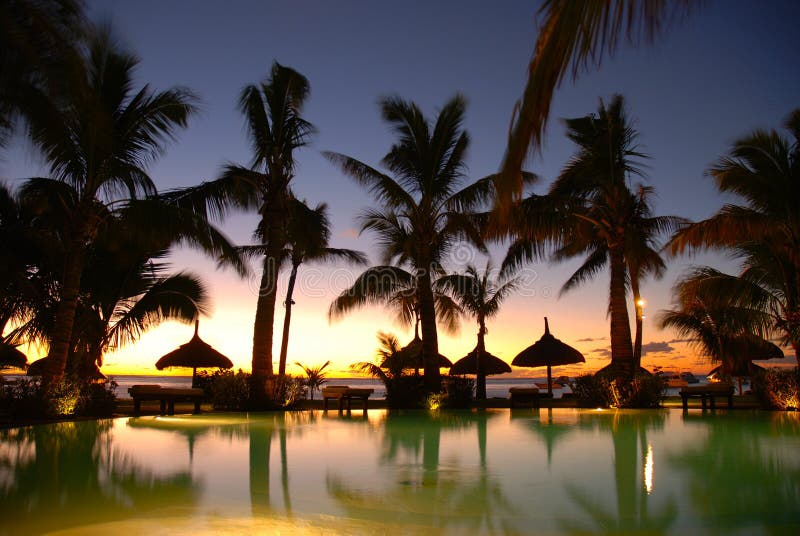 Sunset over pool at resort stock photo. Image of colors - 2743422