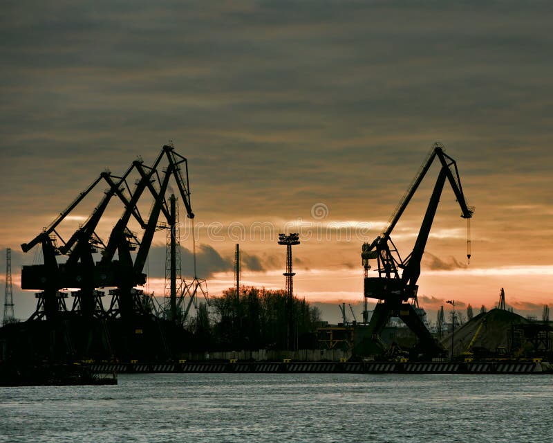 Sunset Over the Port. Cranes in the Port Stock Photo - Image of cargo ...